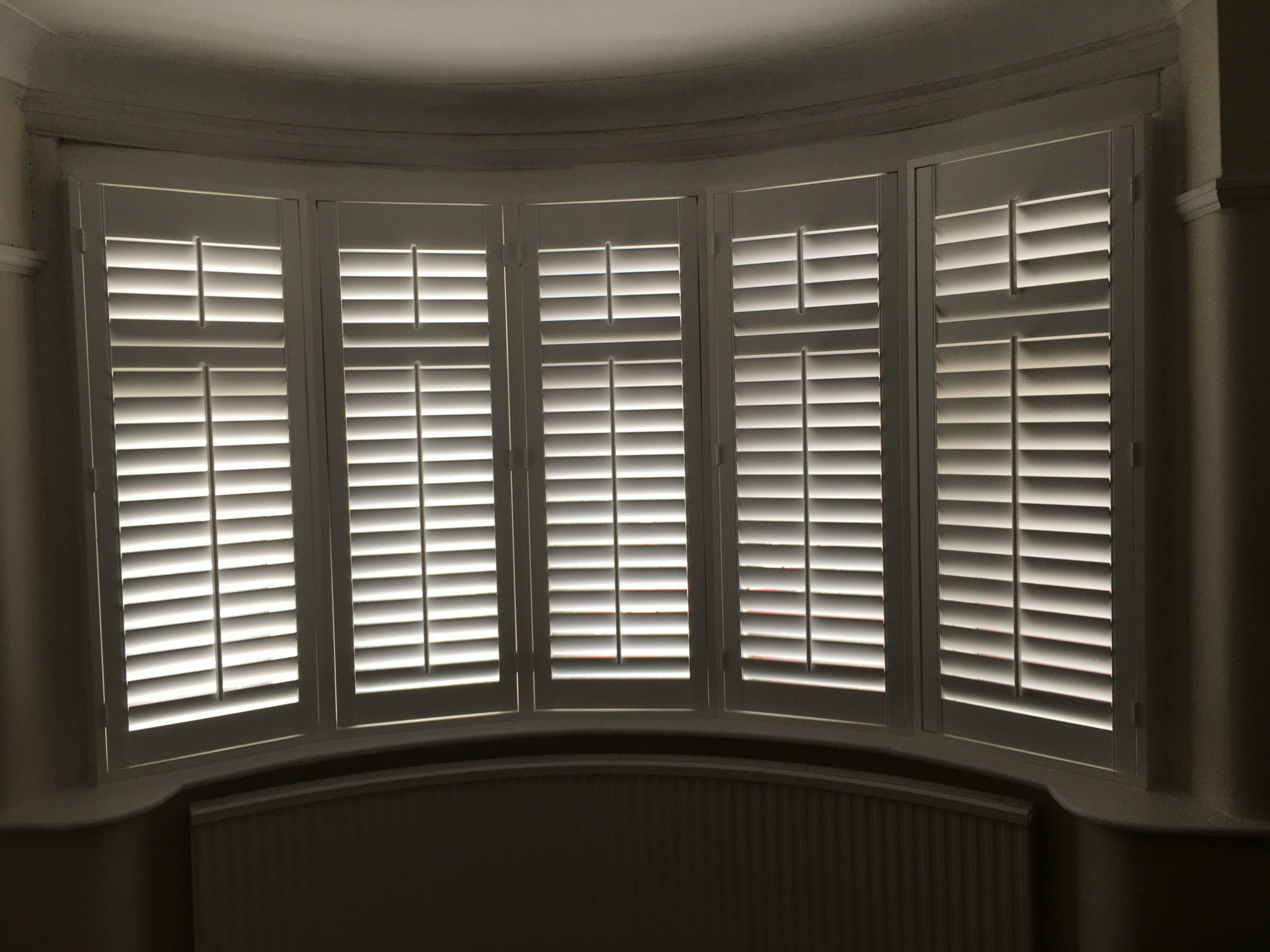 A curved bay window installation in Wilmslow | Absolute Shutters