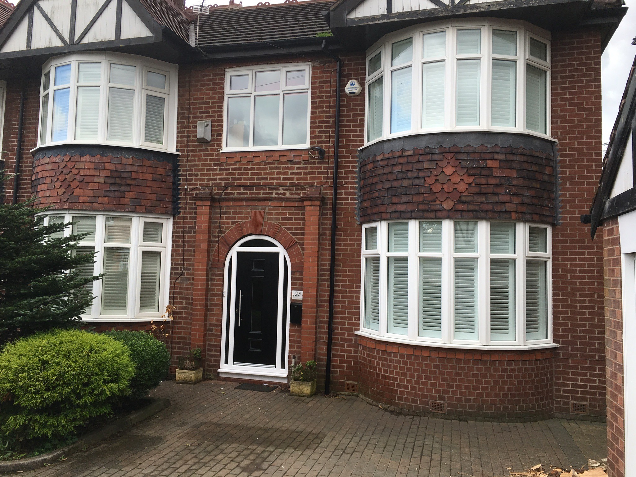Curved bay windows fitted with Plantation Shutters in Audenshaw | Absolute Shutters